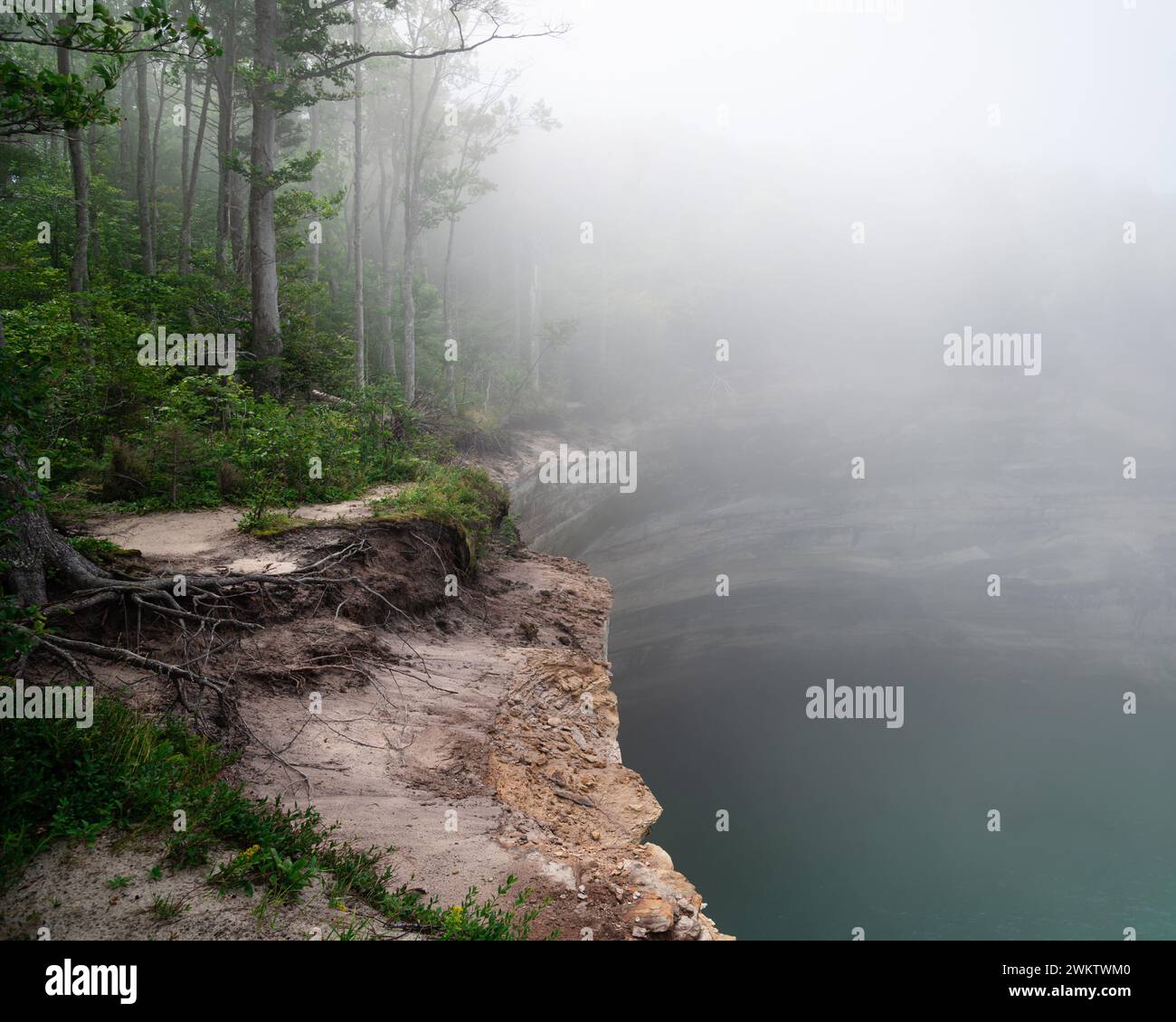 Pictured Rocks shoreline, cliff to Lake Superior in fog Stock Photo - Alamy