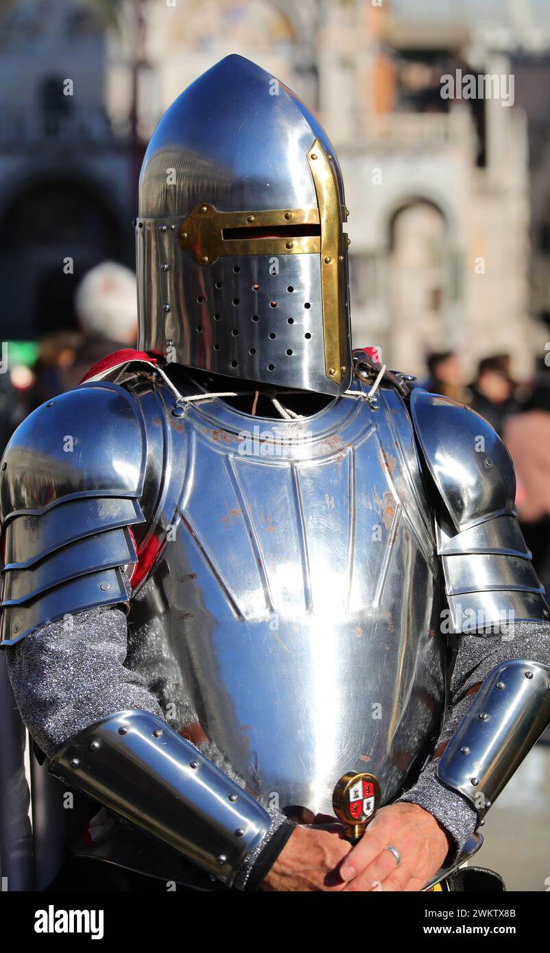 medieval knight with steel armor and large helmet to protect his head ...