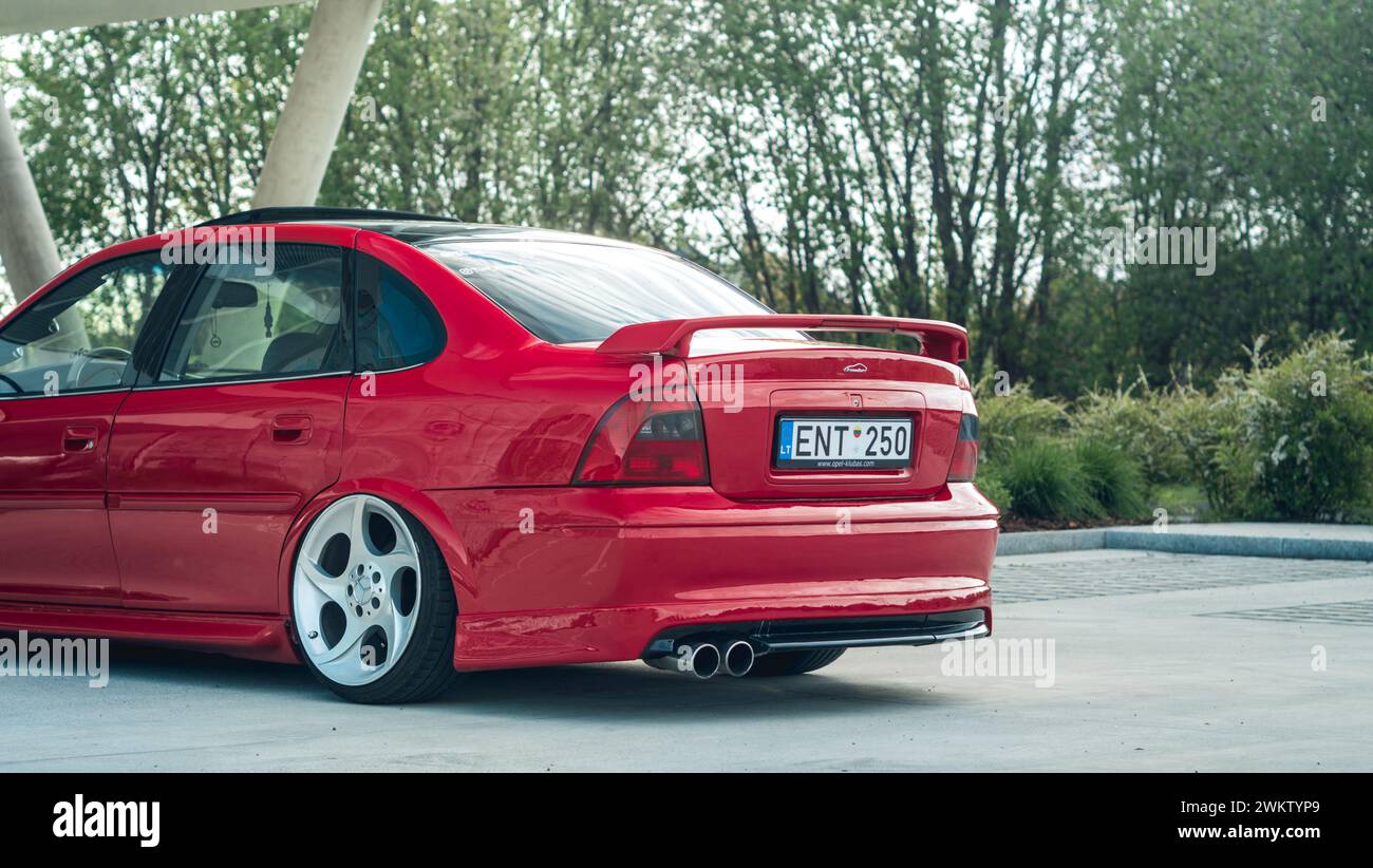 Red car in the city Stock Photo - Alamy
