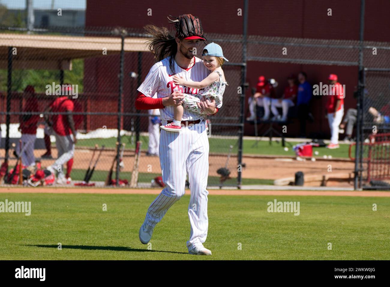 Philadelphia Phillies pitcher Matt Strahm runs on the field with his ...