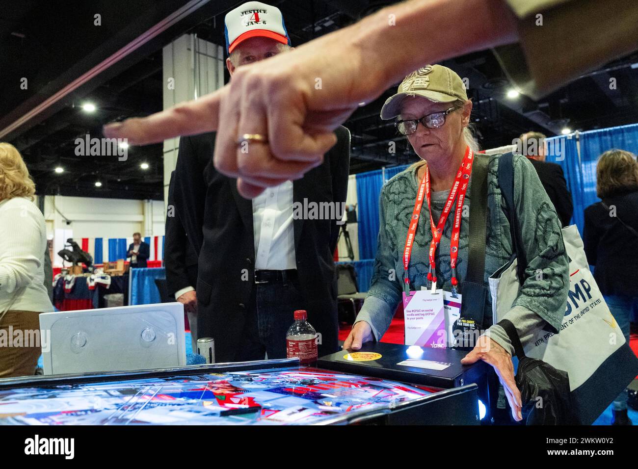 A woman who gave her name as "Sapphire Patriot," right, of Ohio, and ...