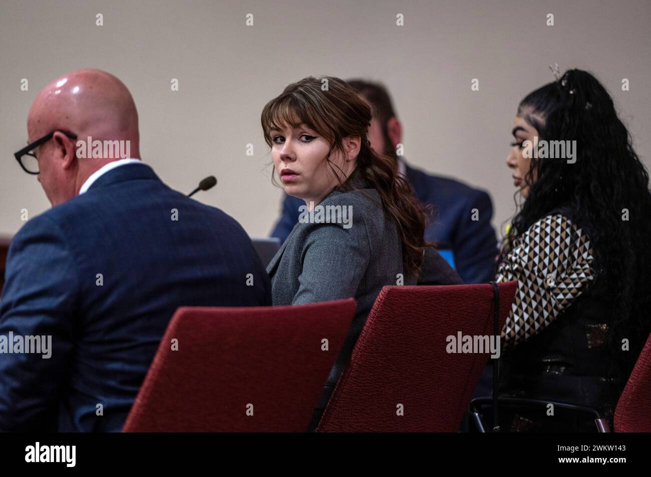 Hannah Gutierrez-Reed, center, sits with her attorney Jason Bowles ...