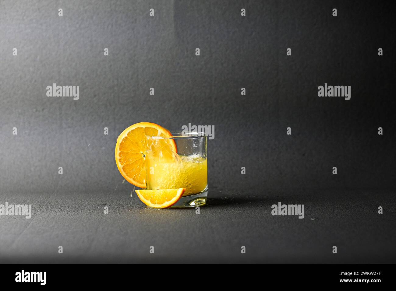 Glass cup orange black hi-res stock photography and images - Alamy