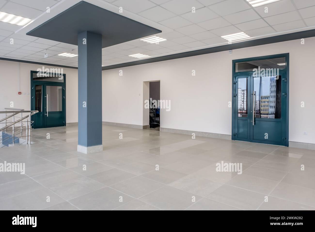 panorama view in empty modern hall with columns, doors , stairs and ...