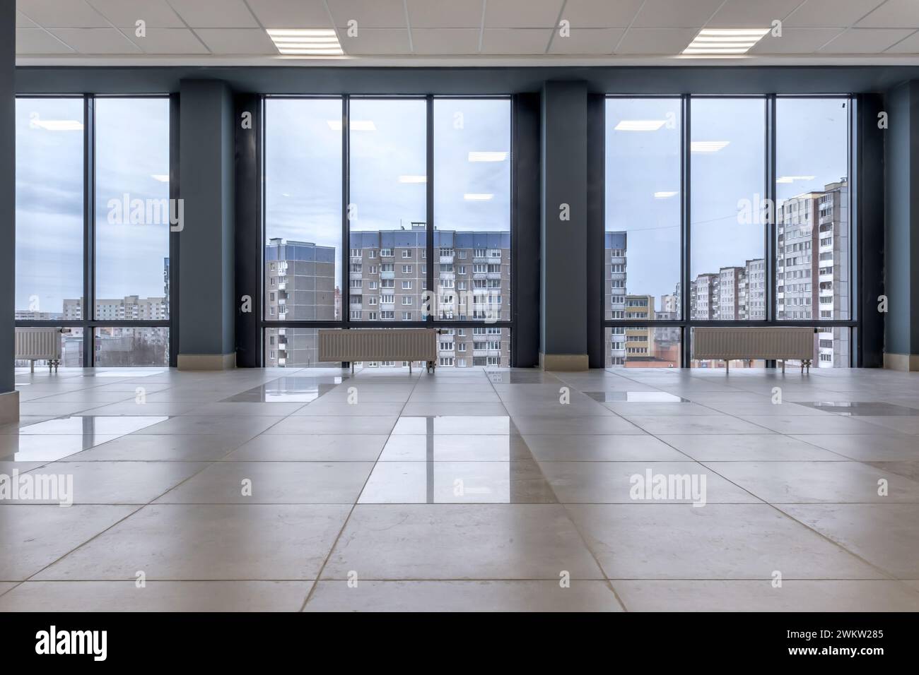 panorama view in empty modern hall with columns, doors , stairs and ...