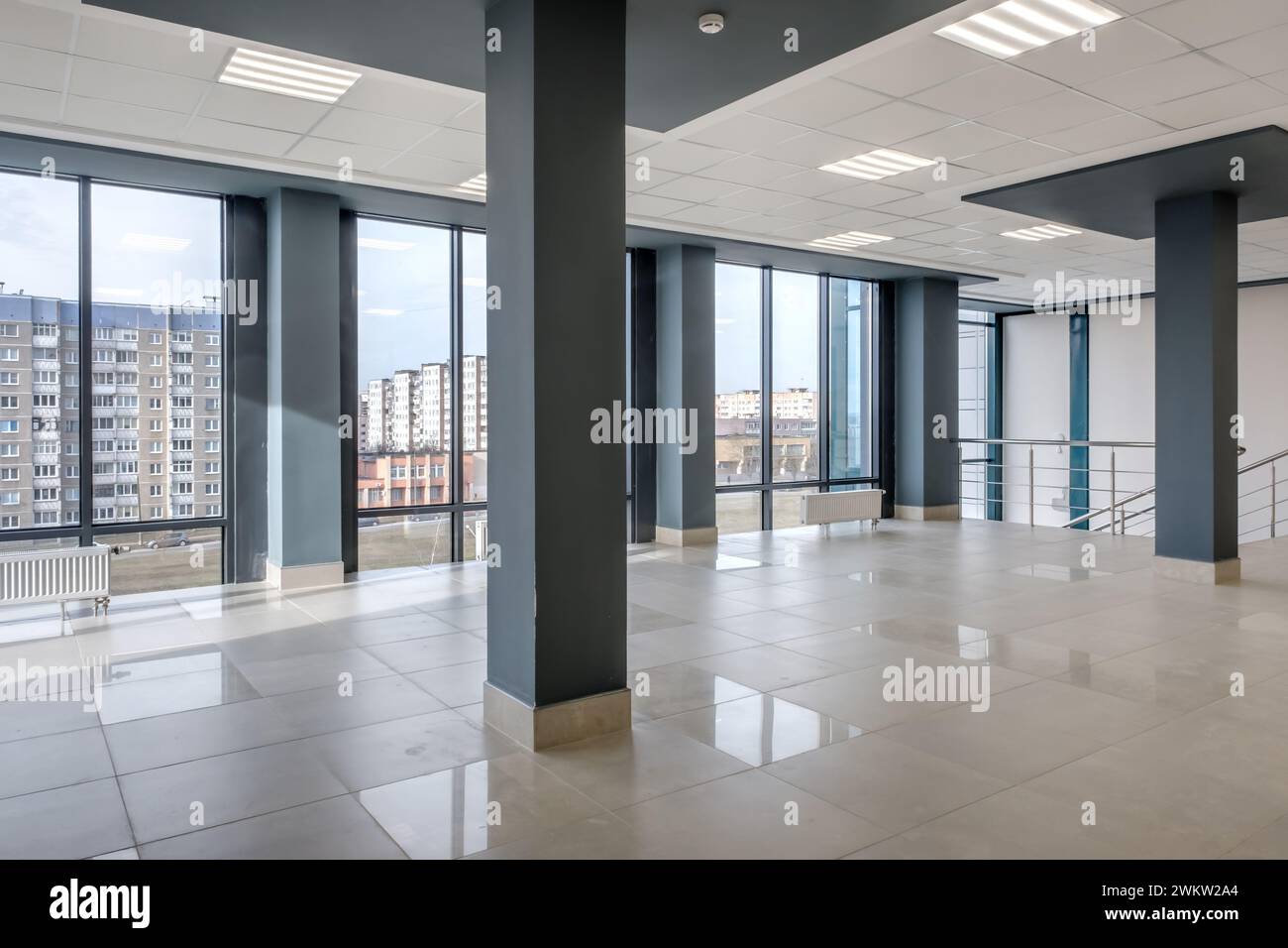 panorama view in empty modern hall with columns, doors , stairs and ...