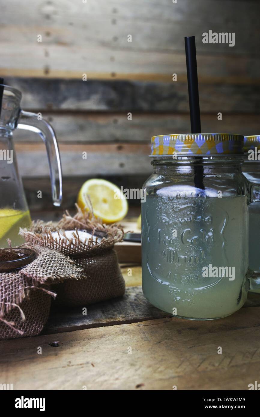 A mason jars filled with water and lemon slices Stock Photo - Alamy