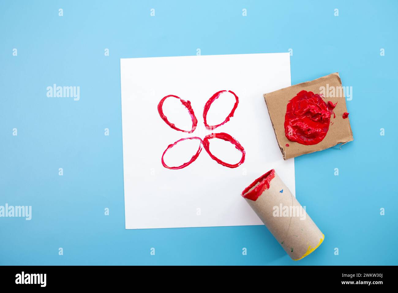 making paper craft butterflies, stamp, paint tubes, recycling concept ...