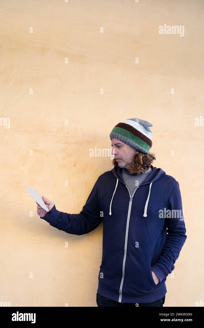 A young man looking at colostomy bag. World Colon Cancer Day Stock ...