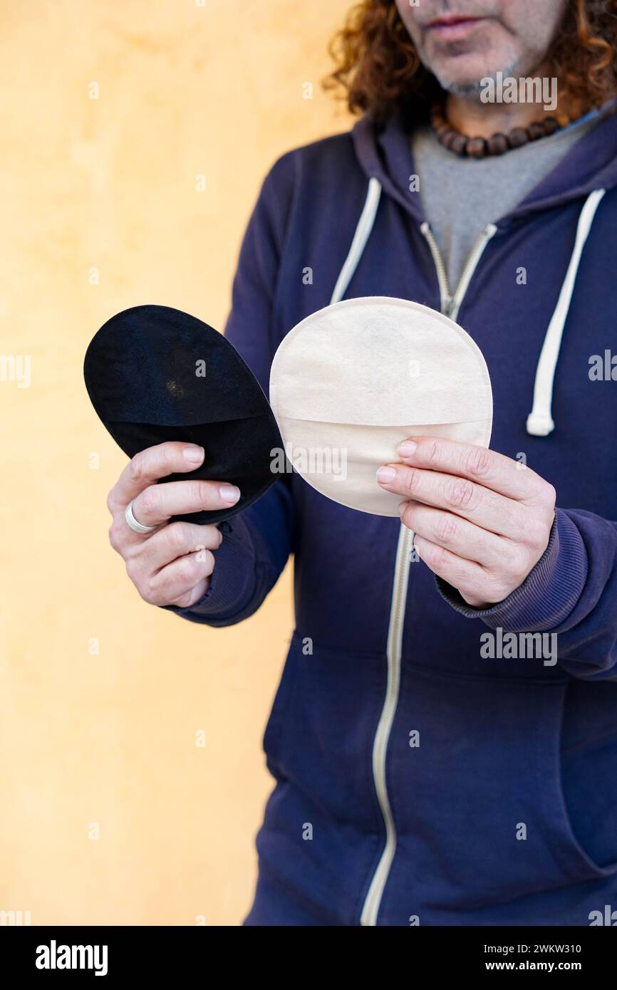 unrecognizable man holding ostomy bags. World Colon Cancer Day ...