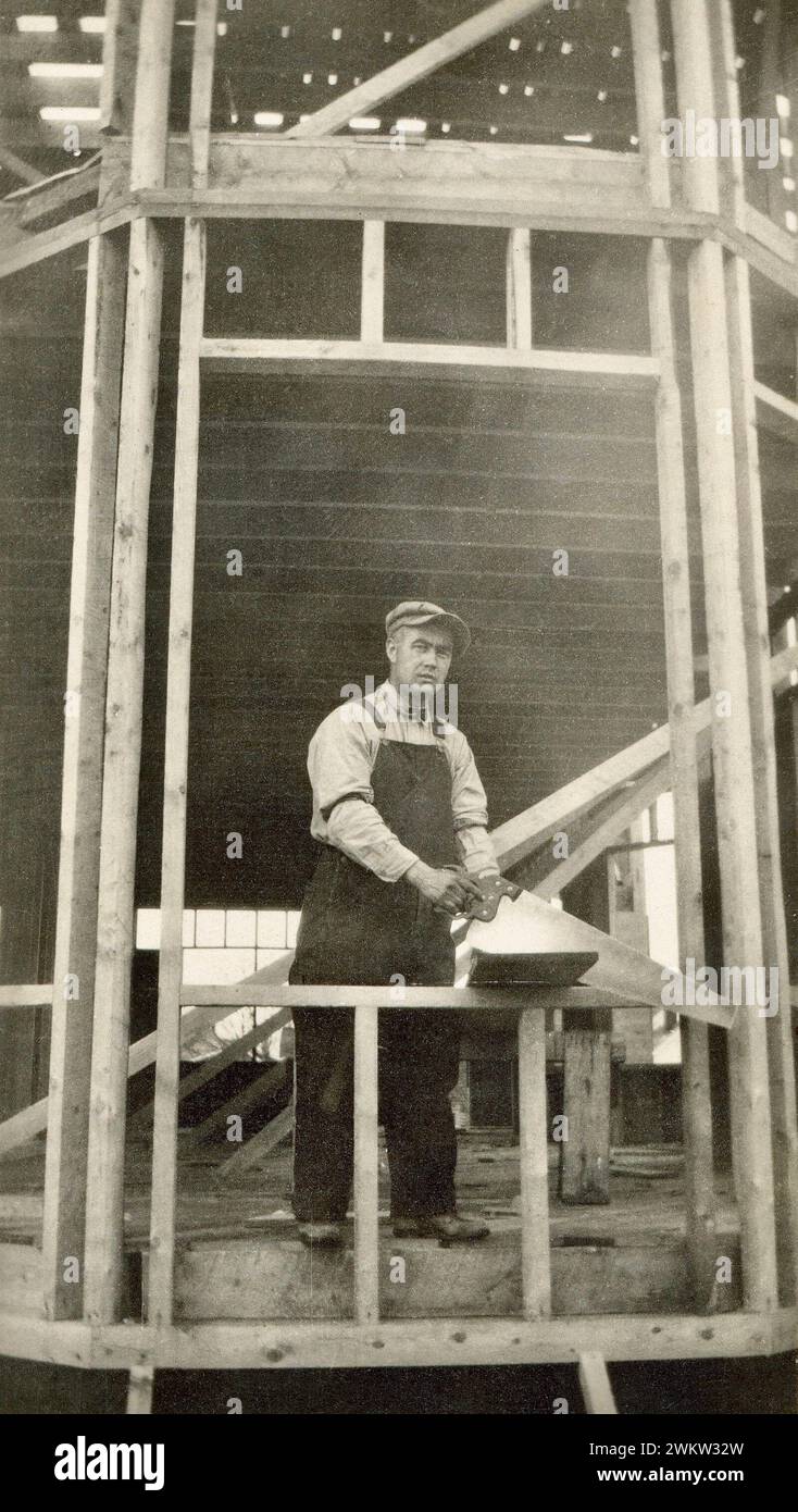 1900s man with saw hi-res stock photography and images - Alamy