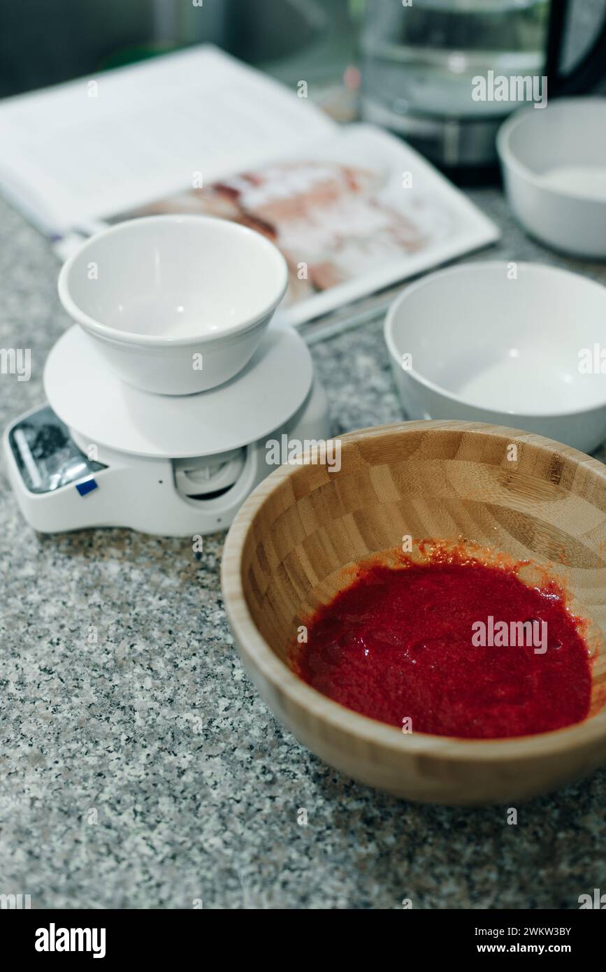 Woman weighing flour on kitchen scale for making cake at home. High ...