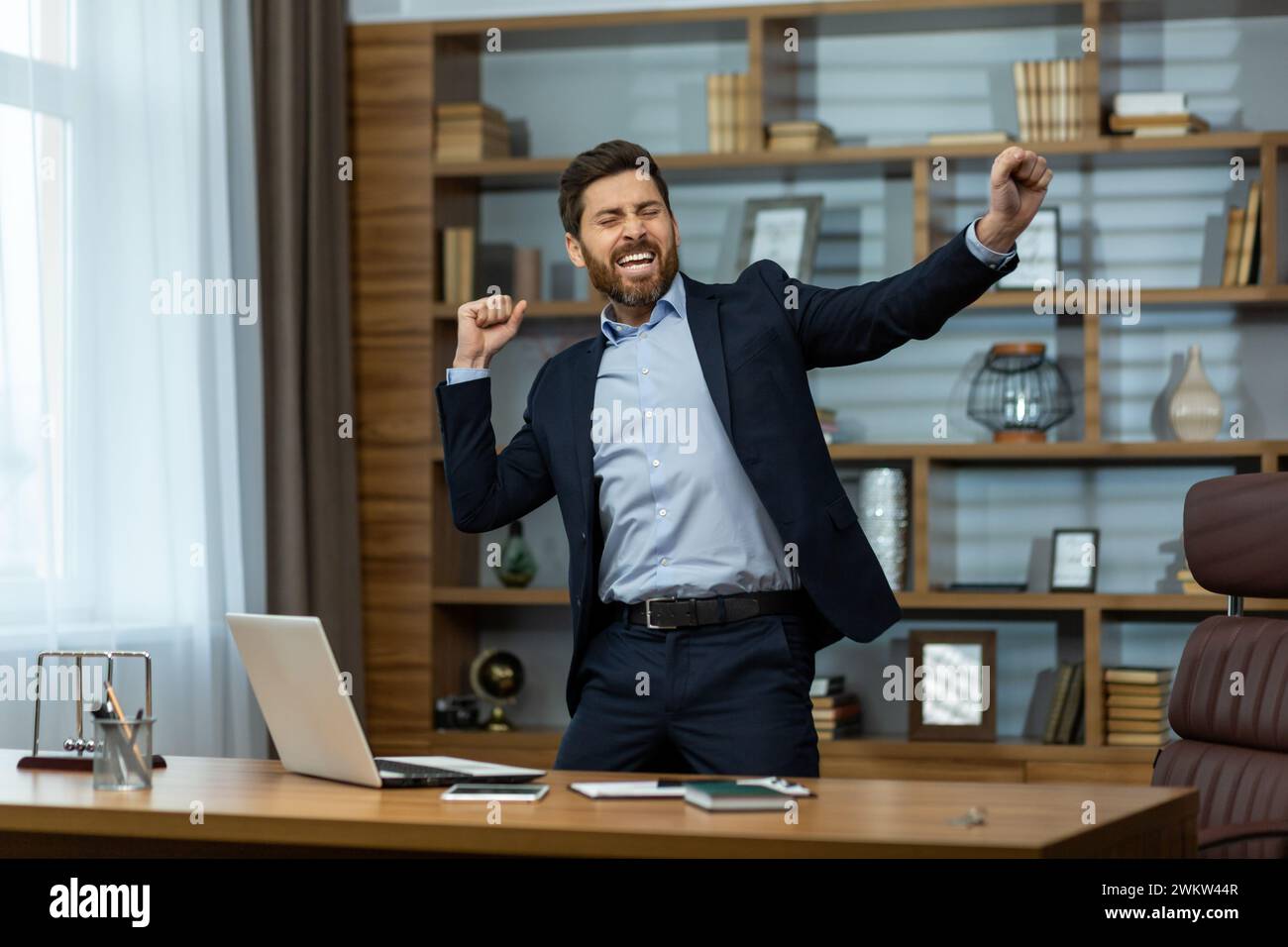 Young man dancing hands up hi-res stock photography and images - Alamy
