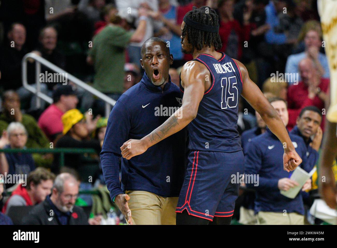 Dayton head coach Anthony Grant, left, celebrates with forward DaRon ...