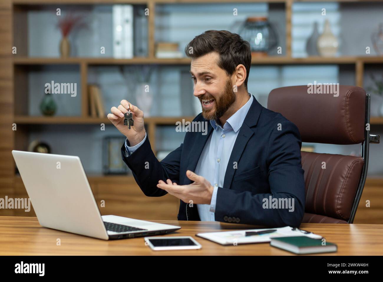 Online operation of buying and selling real estate. Young businessman ...