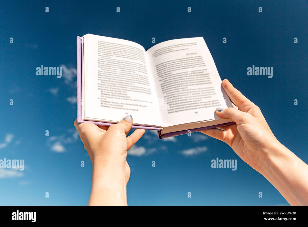 Hands book reader blue hi-res stock photography and images - Alamy