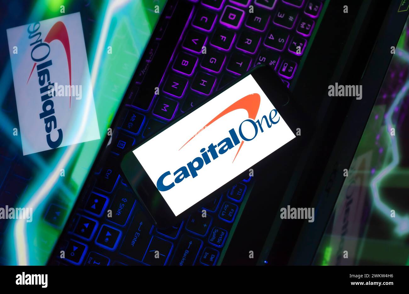 In this photo illustration, the CapitalOne logo is seen displayed on a ...