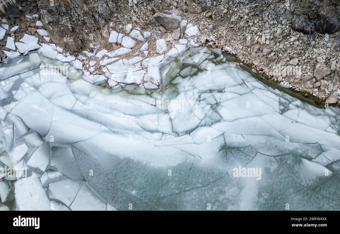 An aerial view of snow, rocks, water, and ice patch Stock Photo - Alamy