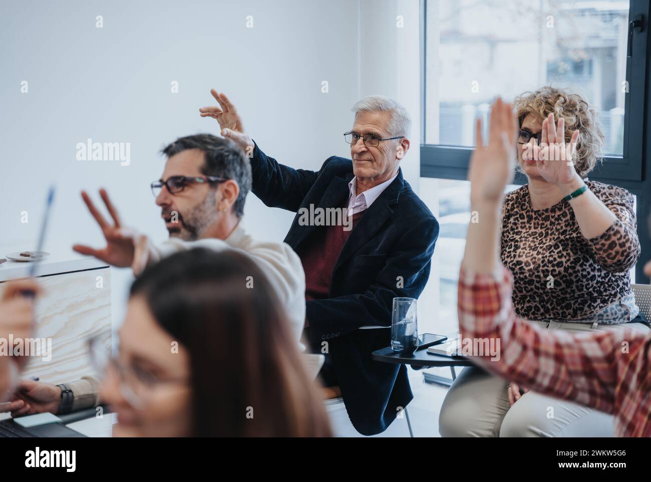 A focused group of employees actively participating in a workshop or ...