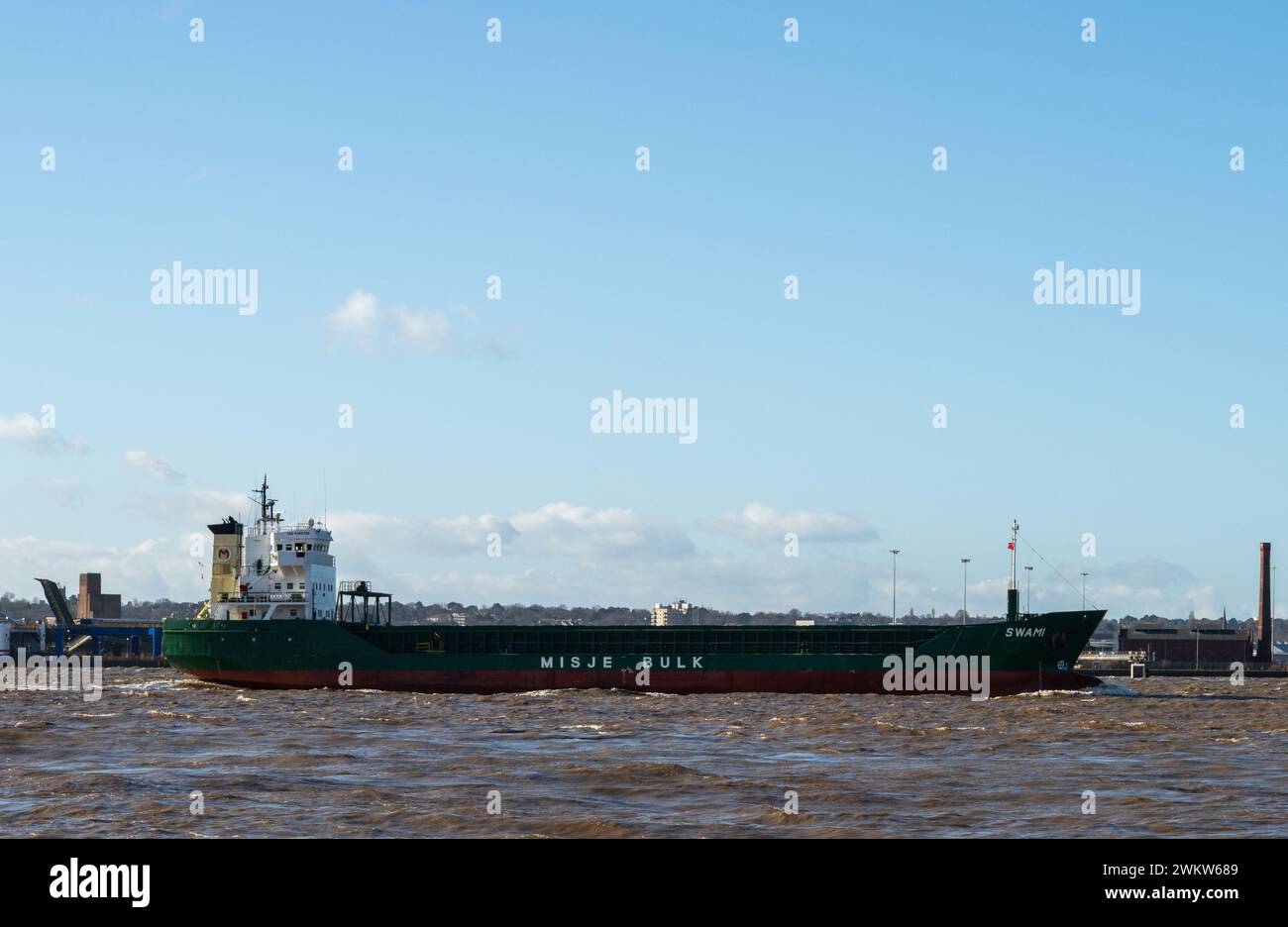 Liverpool, UK 12 Feb 2024: MV SWAMI, a bulk cargo ship makes passage ...