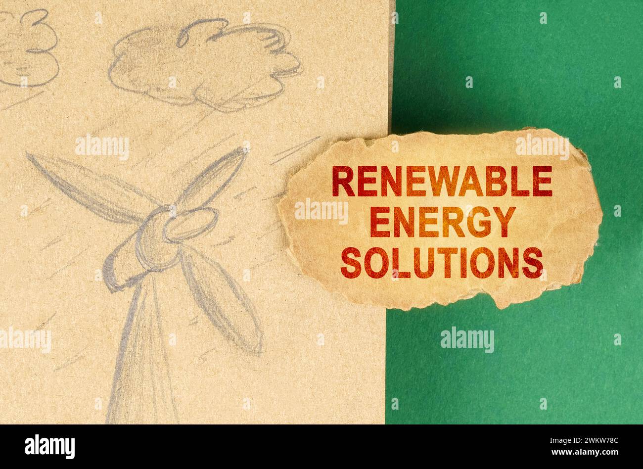 Alternative energy concept. On a green surface there is a drawing with ...