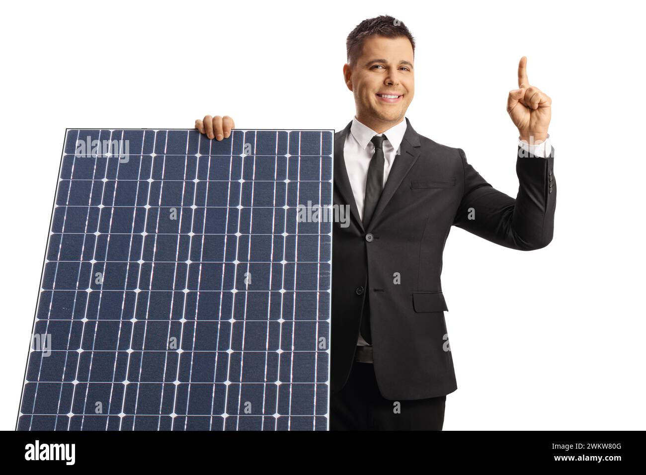 Man behind a solar panel smiling and pointing up isolated on white ...
