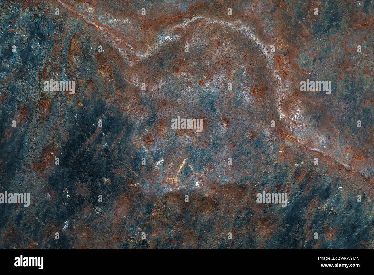 Abstract background from an old metal sheet with dents, worn paint and ...