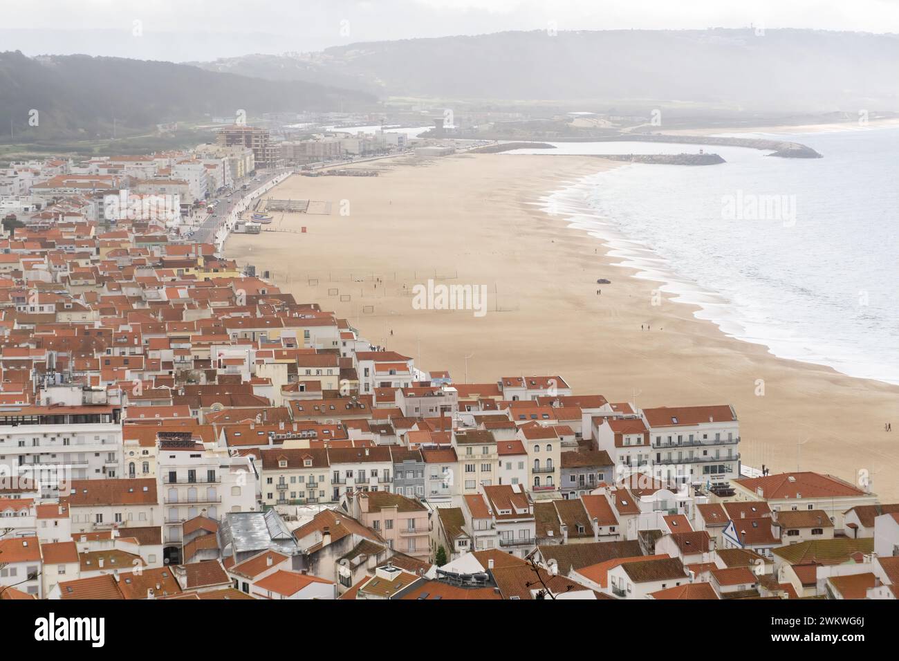 Top view of the streets with white houses and orange tiled roofs, an ...
