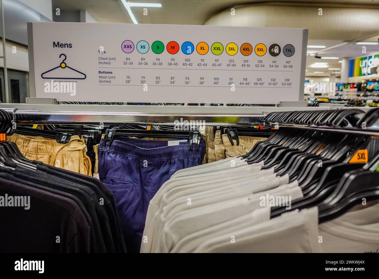 Men's clothing size chart inside a retail store in Australia Stock ...