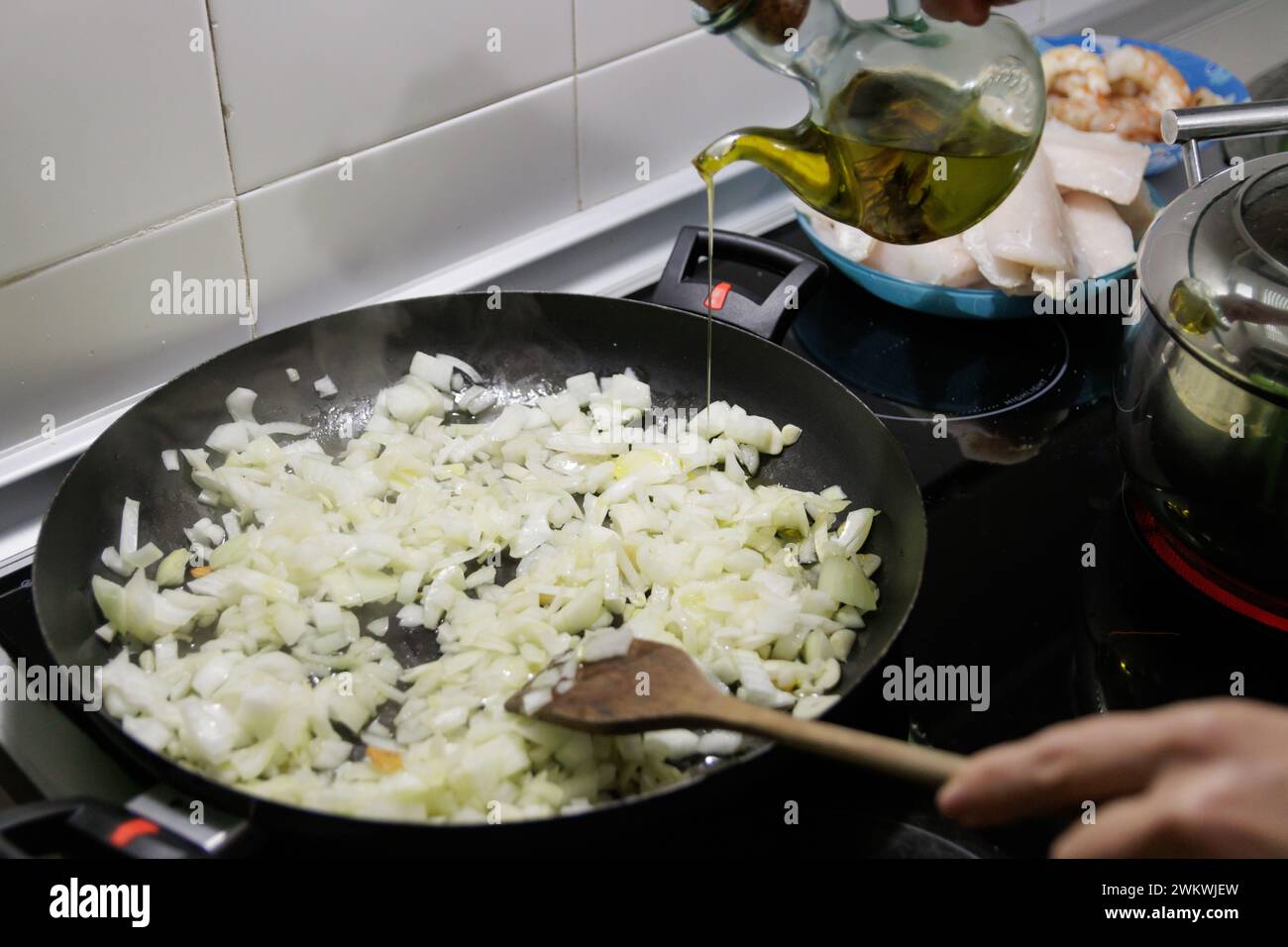Fish in sauce with shrimp. Step by step preparation. Sautéing the ...