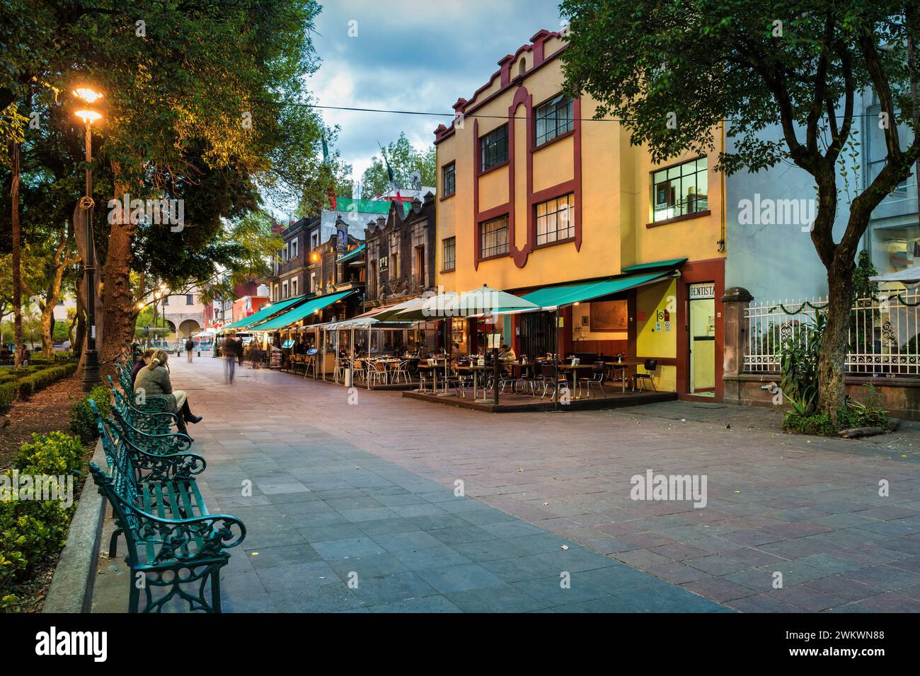People dine on restaurant patios in the historic Coyoacan district of ...