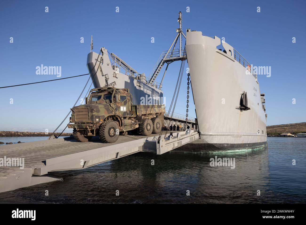 A U.S. Marine Corps Medium Tactical Vehicle Replacement truck is loaded ...