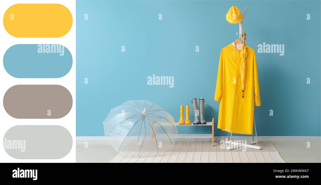 Stylish interior of modern hallway with raincoat and gumboots ...