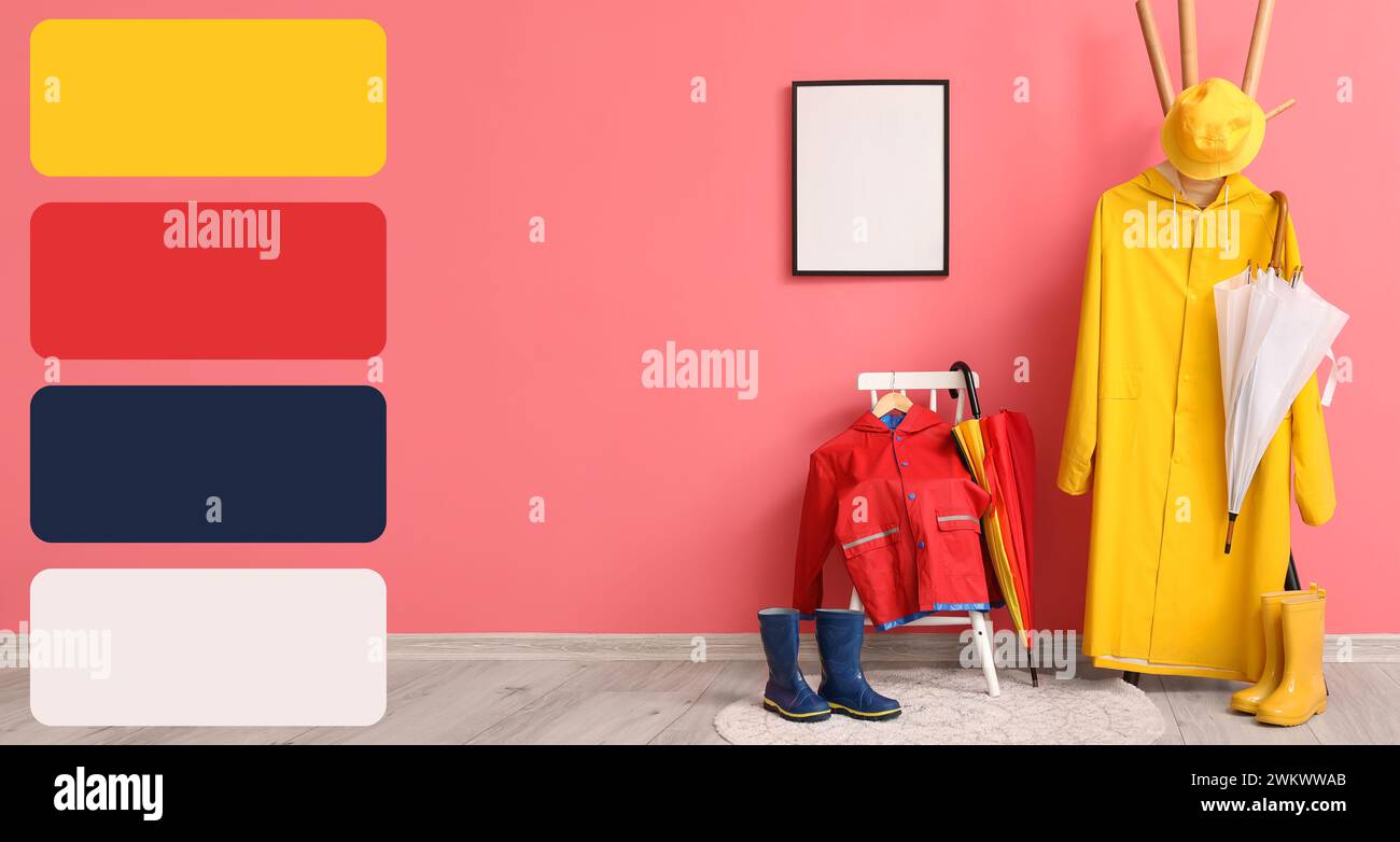 Stylish interior of modern hallway with raincoats, umbrellas and ...