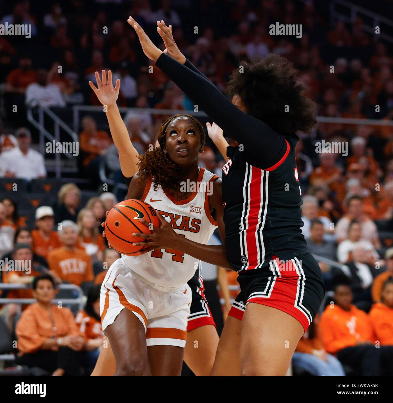 February 21, 2024: Texas forward Amina Muhammad (14) works against ...
