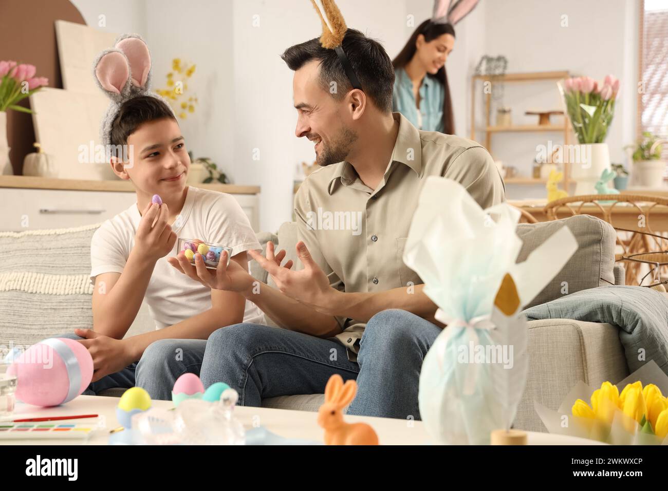 Little boy with Easter eggs and his father at home Stock Photo - Alamy