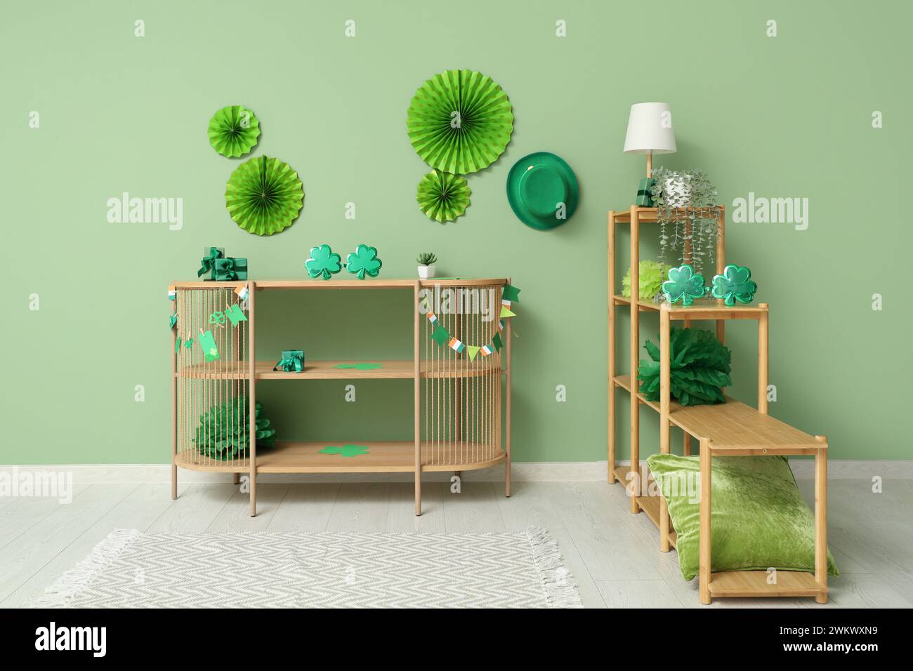 Interior of festive living room with wooden shelving unit and ...