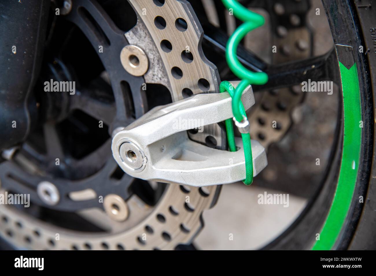 A brake disc lock on a cast aluminum brake disc. The owner's green ...