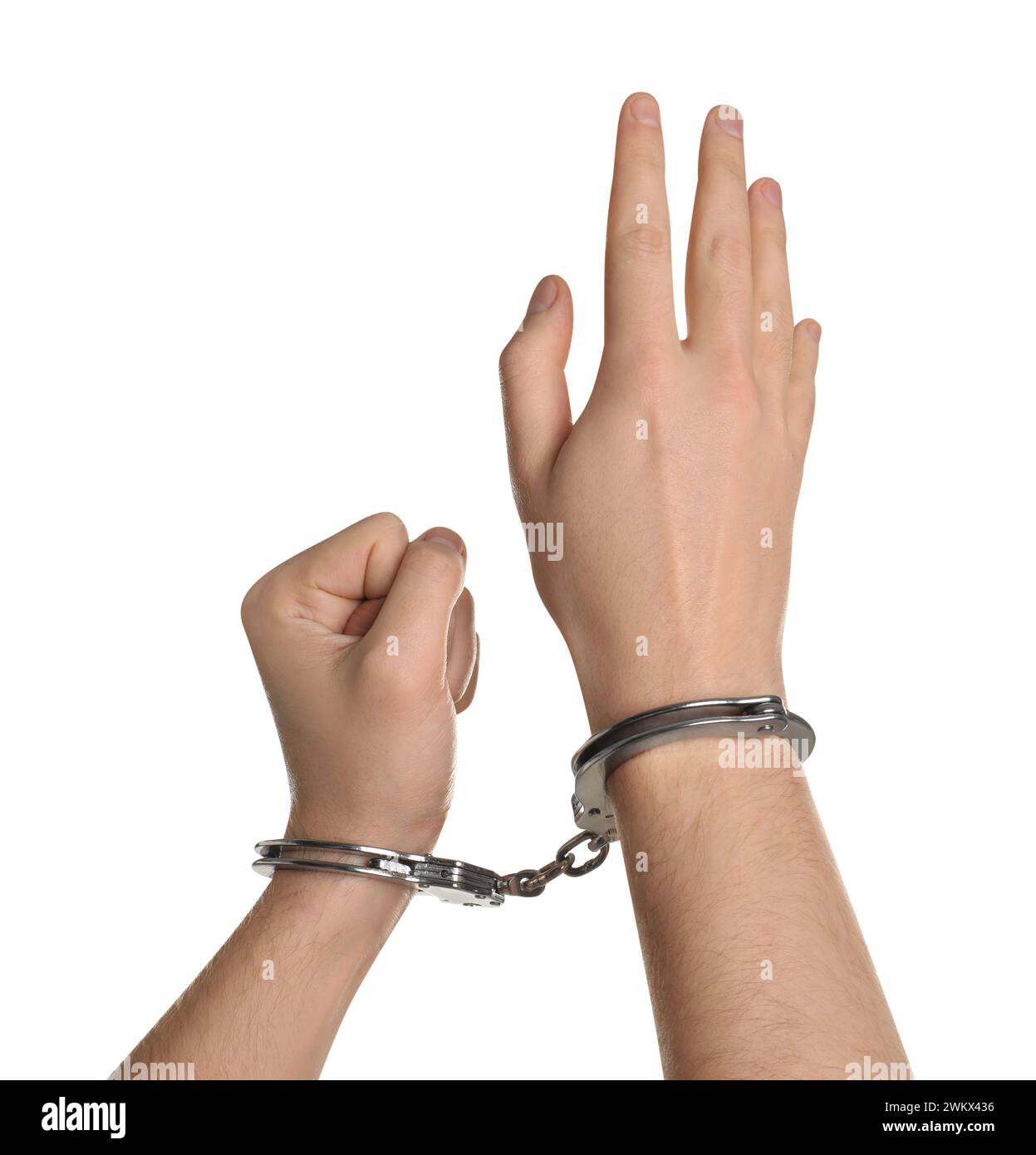 Freedom concept. Man with handcuffs on his hands against white ...