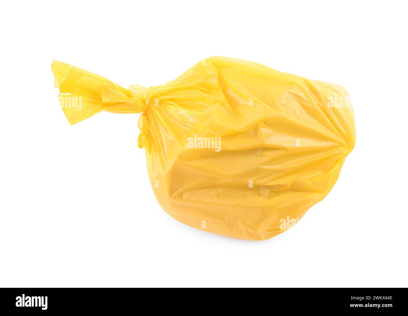 Yellow plastic garbage bag isolated on white Stock Photo - Alamy
