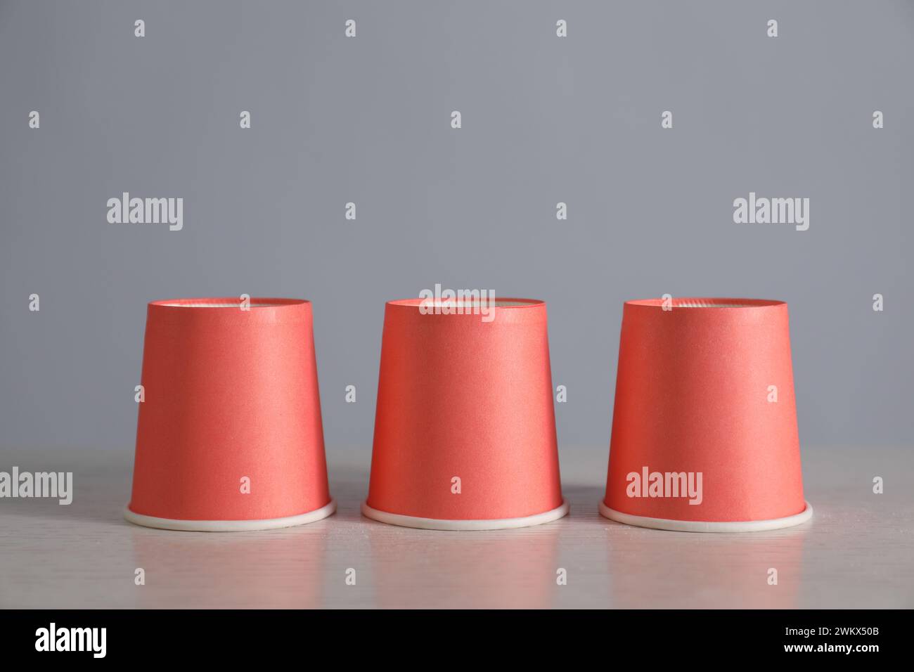 Three cups magic trick hi-res stock photography and images - Alamy