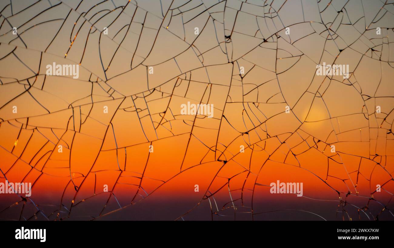 Sunset gradient through cracked glass Stock Photo - Alamy