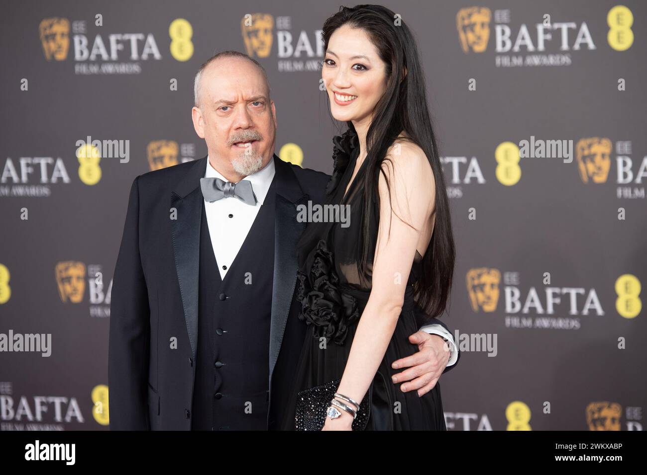 London, UK. 18 Feb, 2024. Pictured: (L-R) - Paul Giamatti, partner ...