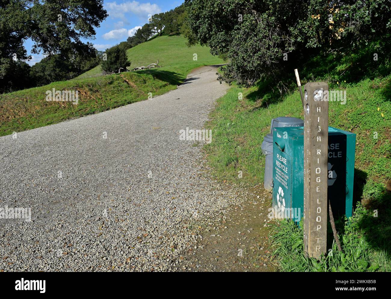 trail direction post in Dry Creek Regional Park, green hills during the ...