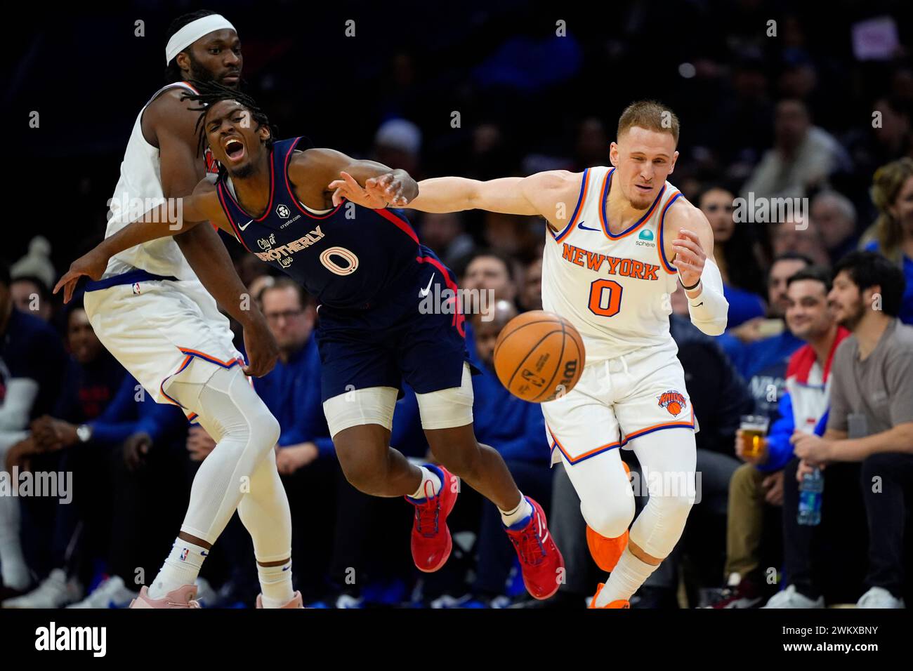 Philadelphia 76ers' Tyrese Maxey, center, tries to get past New York ...