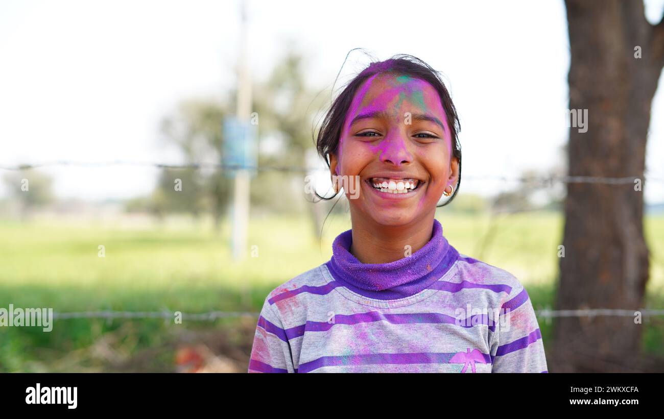 Children covered in colored powder during the festival of Holi. Happy ...