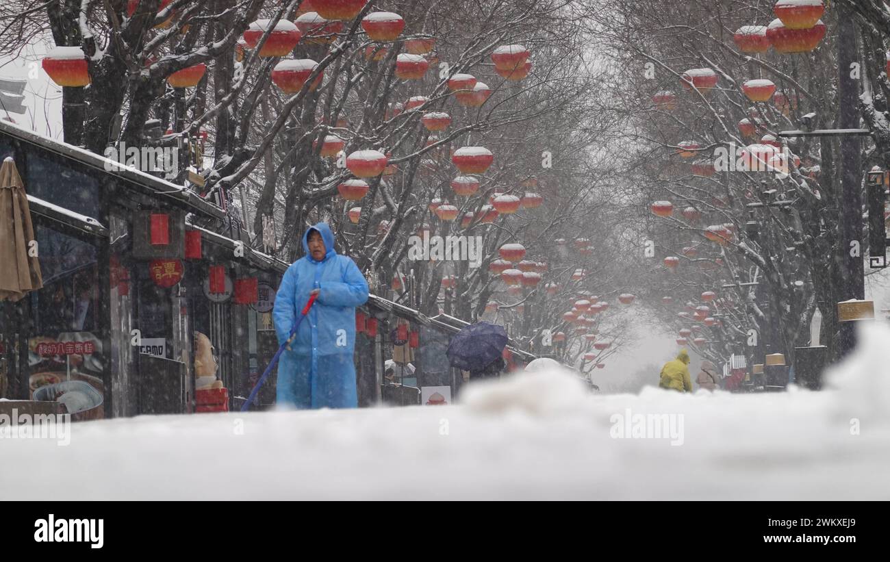 XI'AN, CHINA - FEBRUARY 23, 2024 - Workers clear snow at the Grand Tang ...