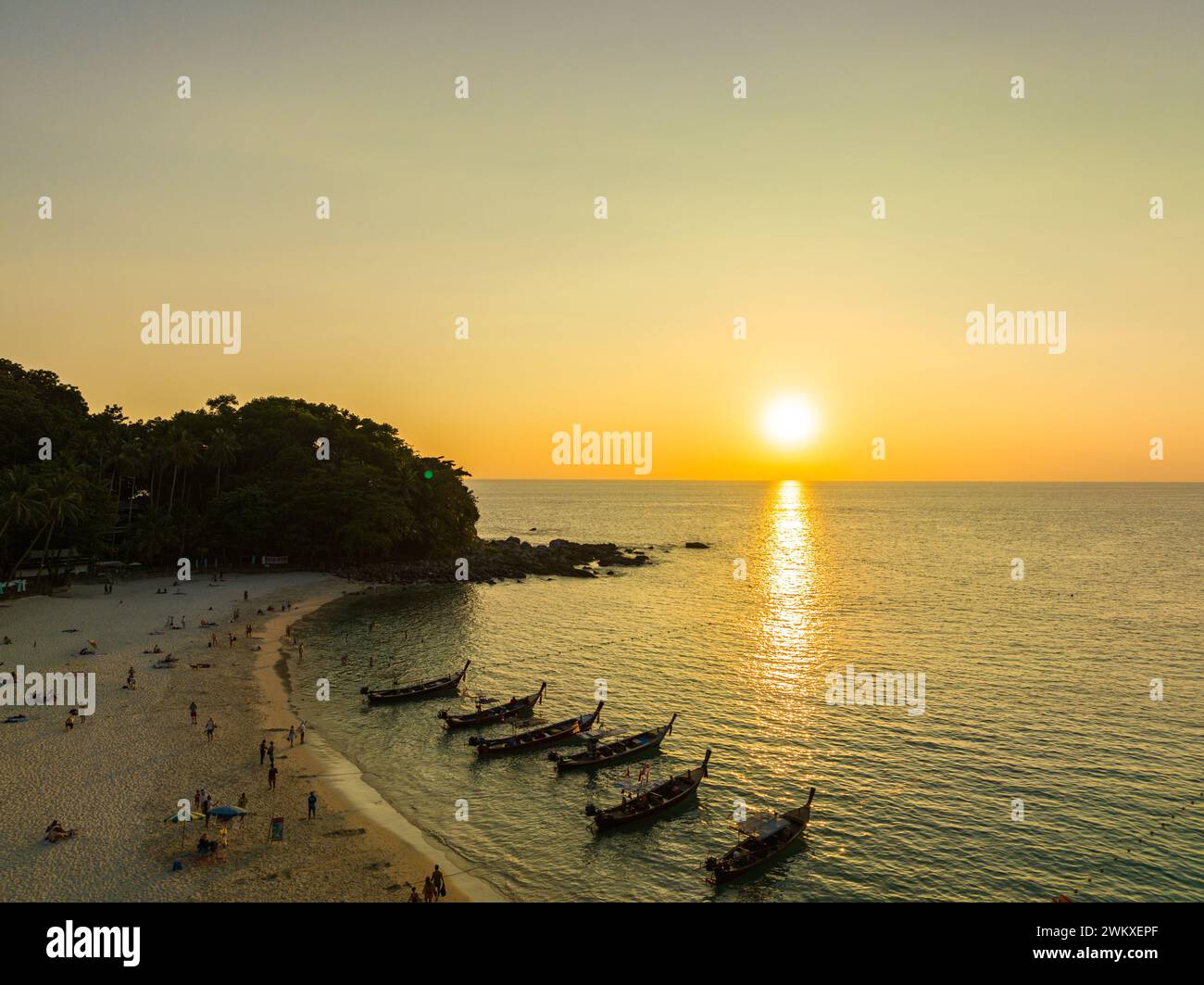 aerial view golden sky in sunset above the freedom beach Patong Phuket ...