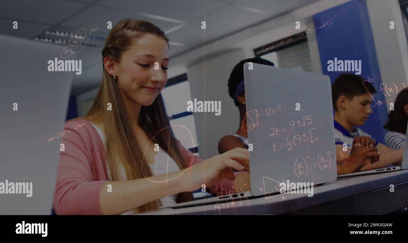 Image of mathematical equations over students using laptops in ...