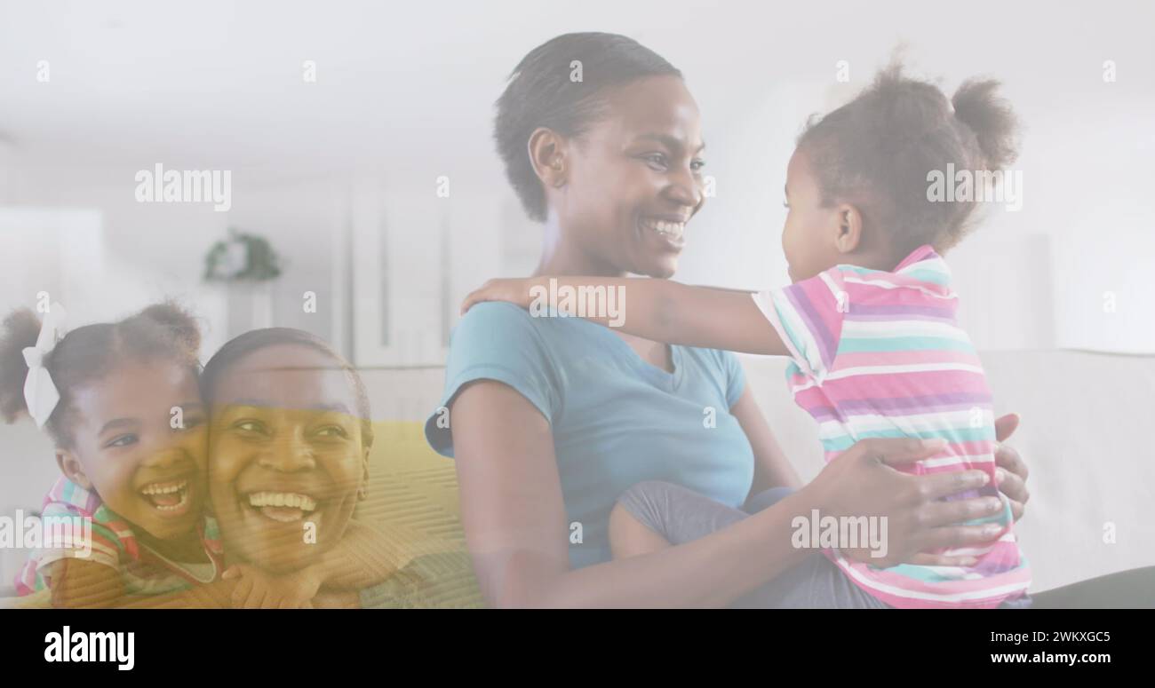 Composite of happy african american mother and daughter, embracing and hugging at home Stock ...